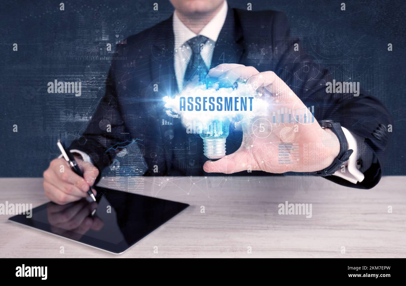 Businessman holding a light bulb, business concept Stock Photo - Alamy