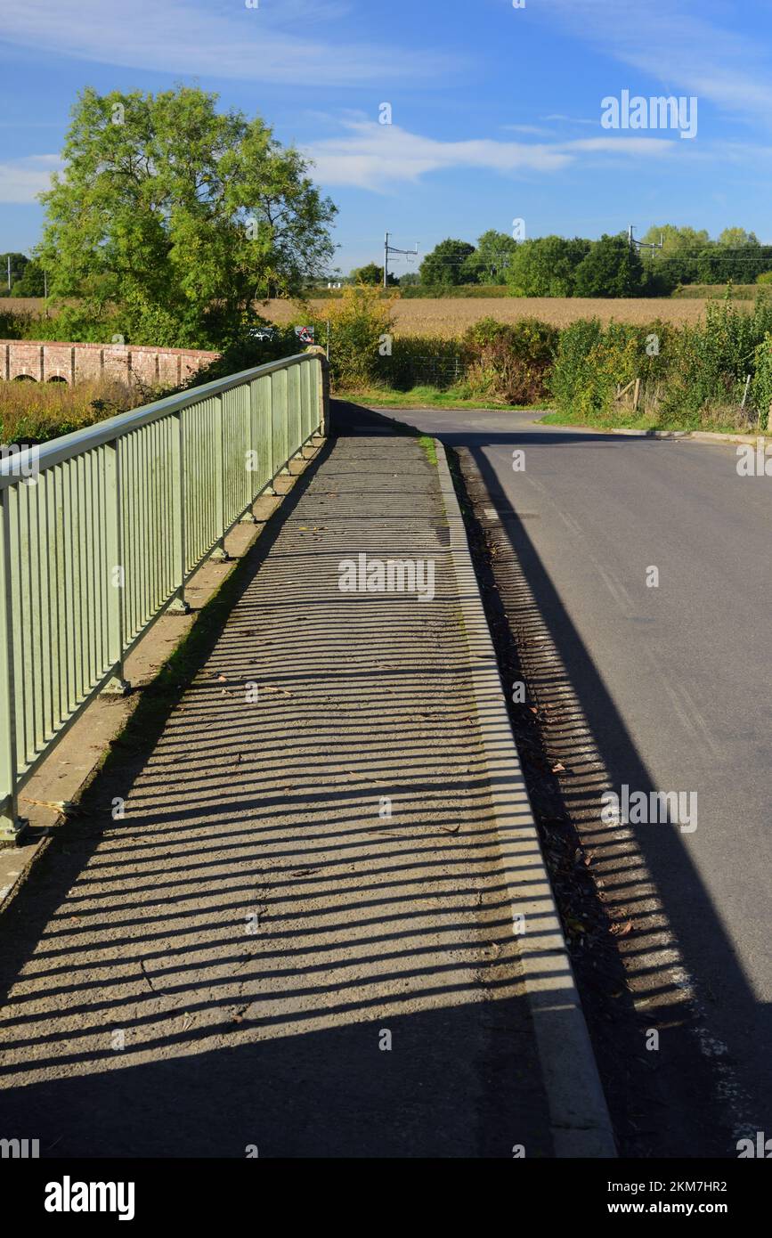 Shadows on the road bridge over the river Avon at Kellaways, part of ...