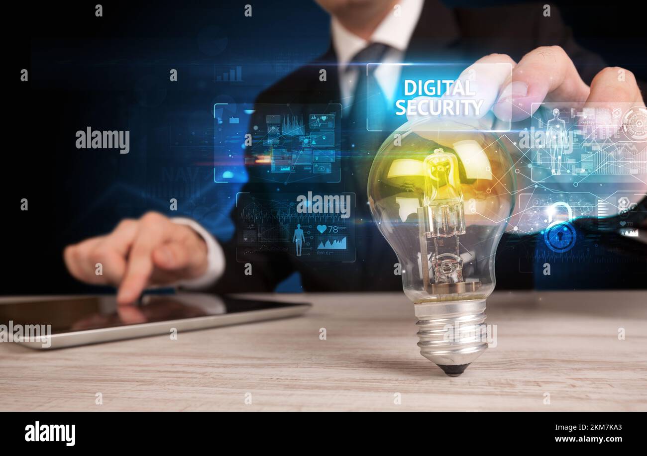 Businessman holding a light bulb, online security concept Stock Photo ...