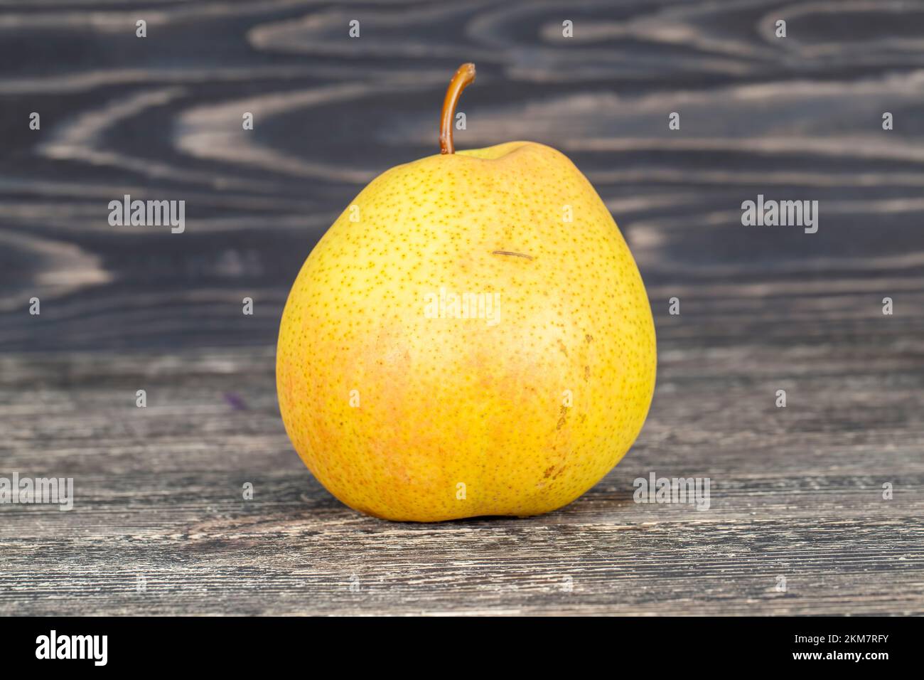 a whole ripe pear while cooking, juicy and ripe pear in the kitchen ...