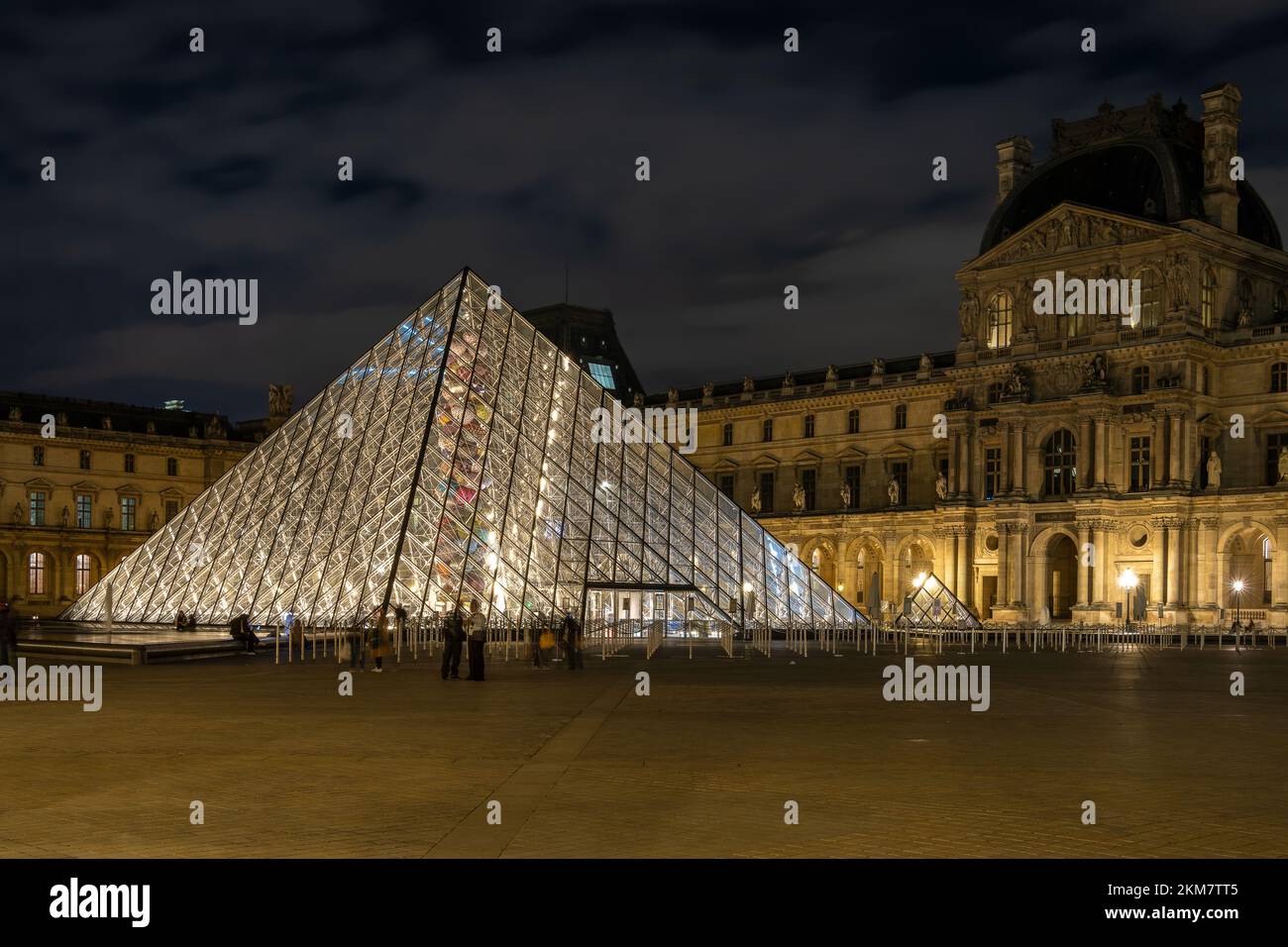 The Louvre glass pyramid illuminated at night, paris, France Stock ...