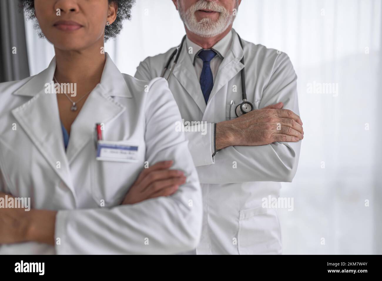 Picture of experienced doctors, crossing their arms, posing Stock Photo ...