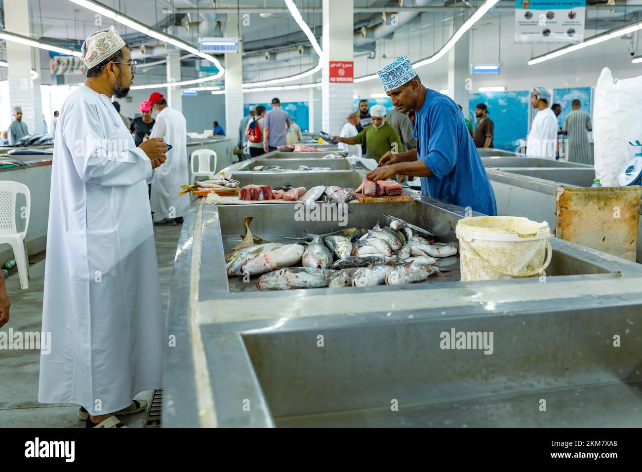 MUTRAH, OMAN - NOVEMBER 14, 2022: Vendors selling tuna, sardines and ...