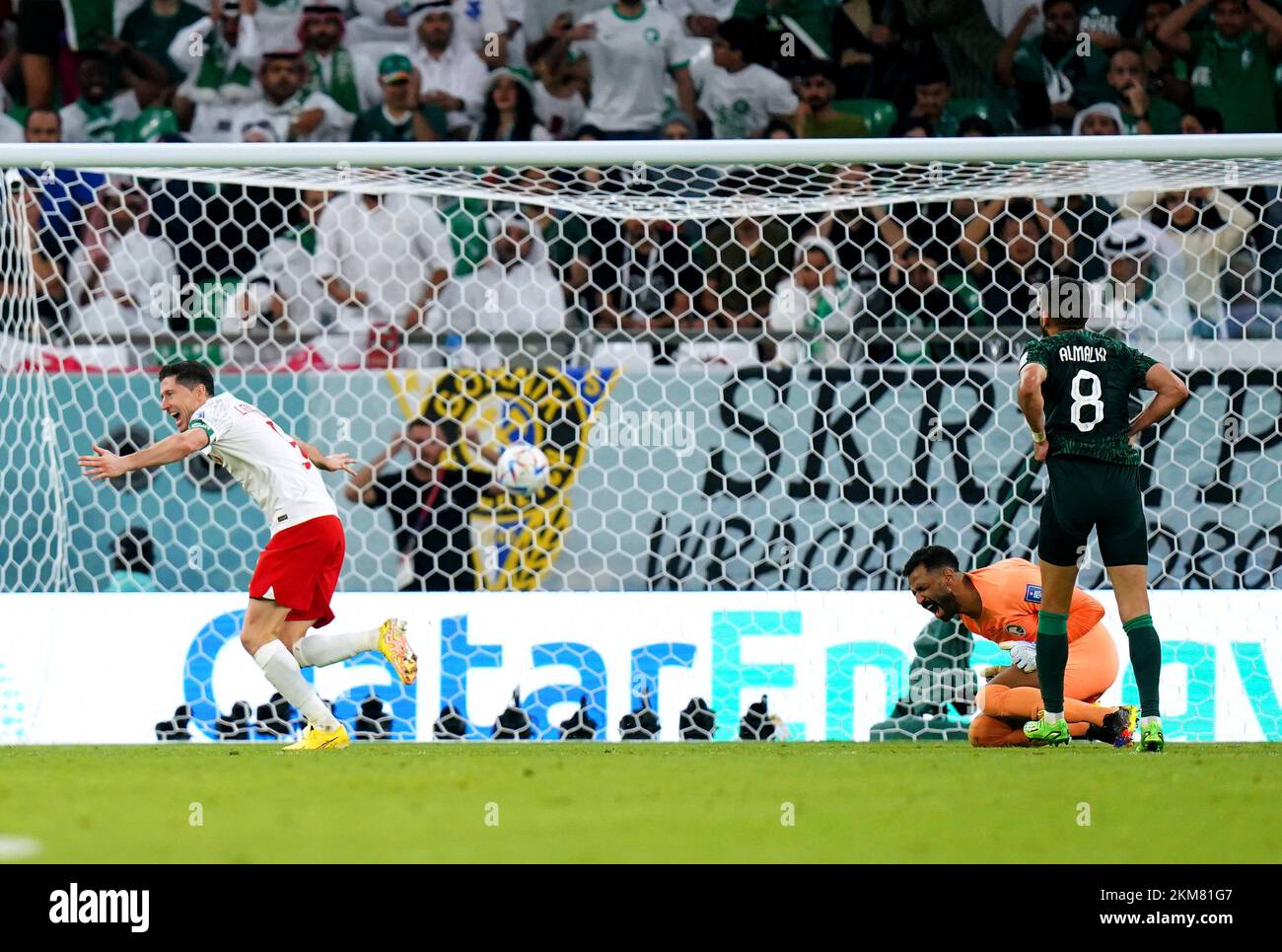 Poland's Robert Lewandowski (left) celebrates scoring their side's ...