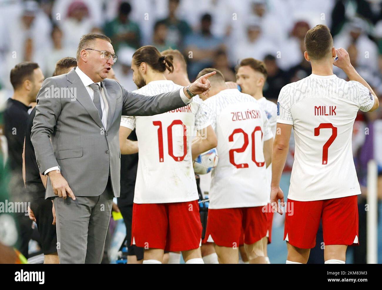 Poland head coach Czeslaw Michniewicz (far L) gives instructions to his ...