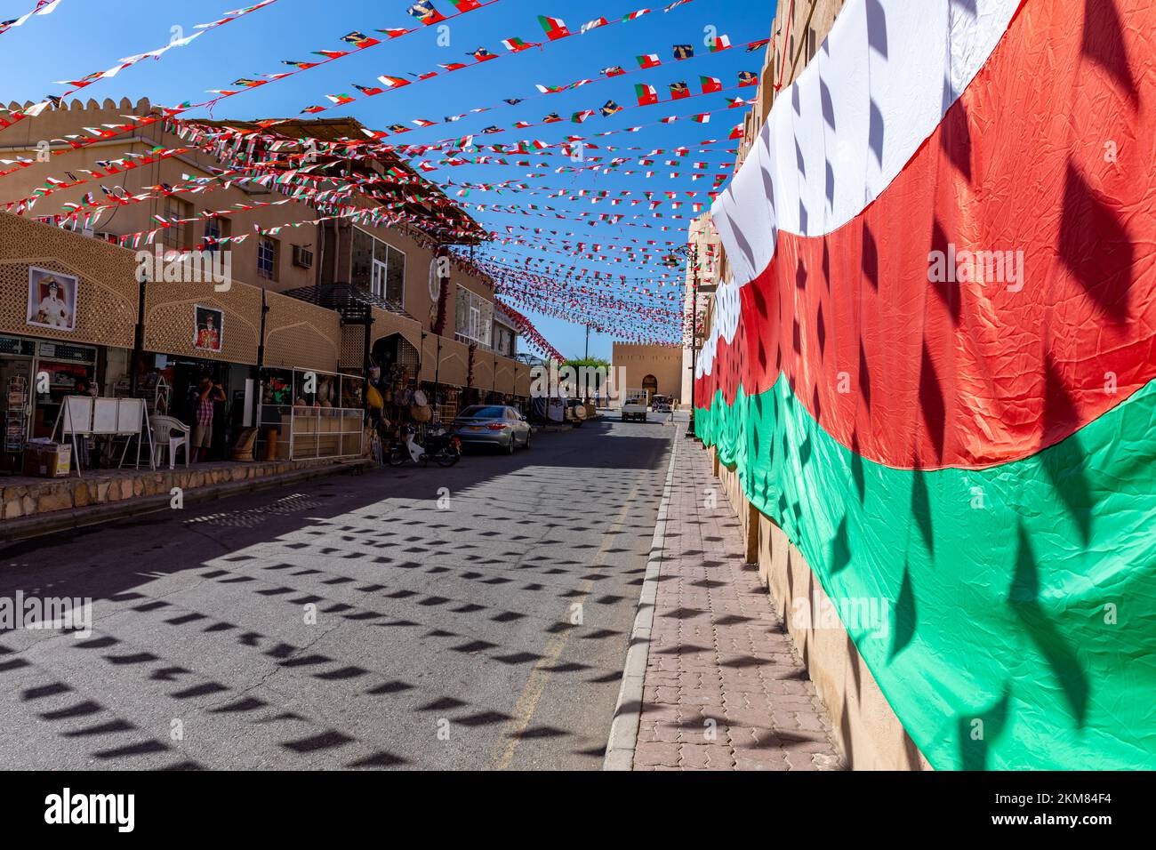 Oman national flag during Independence Day. Traditional medieval ...