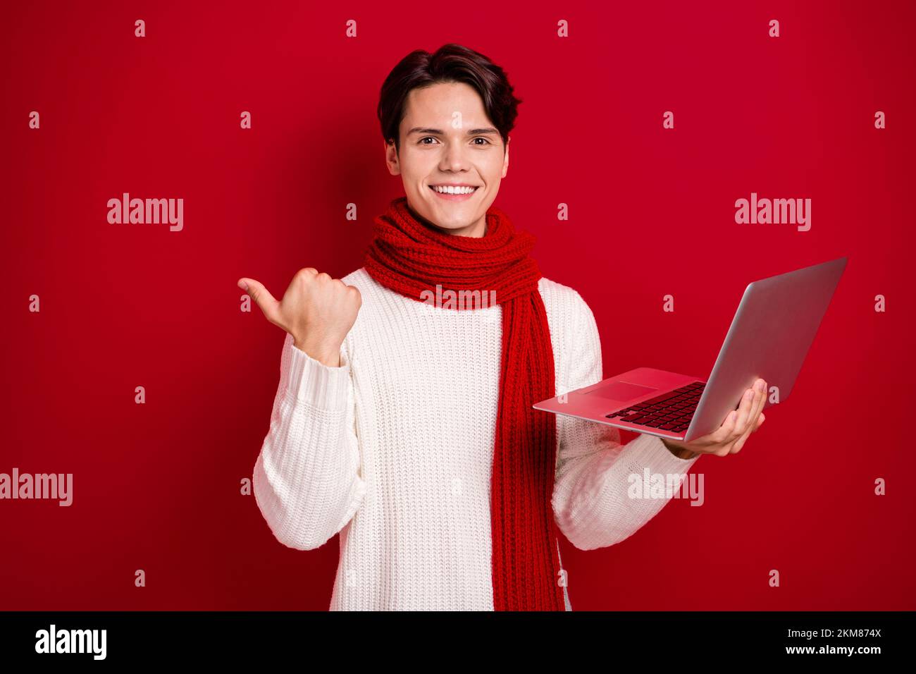 Portrait photo of influencer guy red scarf hold his computer finger ...