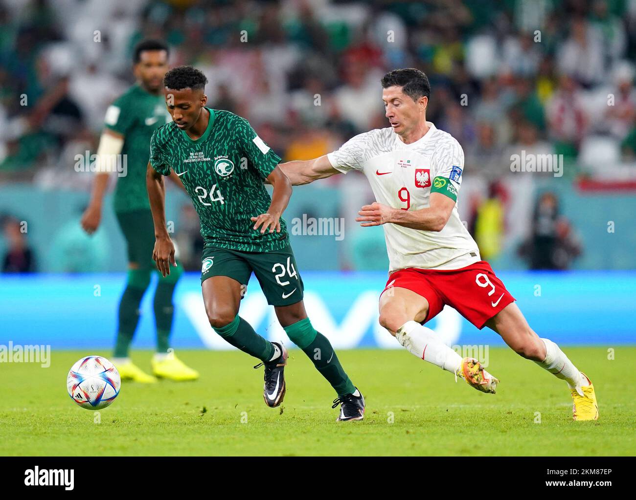 Saudi Arabia's Nasser Al-Dawsari (left) and Poland's Robert Lewandowski ...