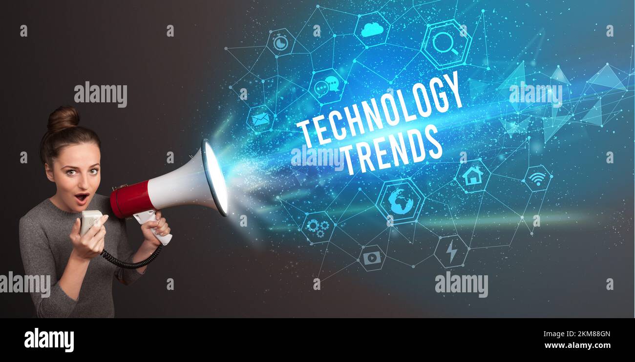 Young woman shouting in megaphone, technology announcement concept ...