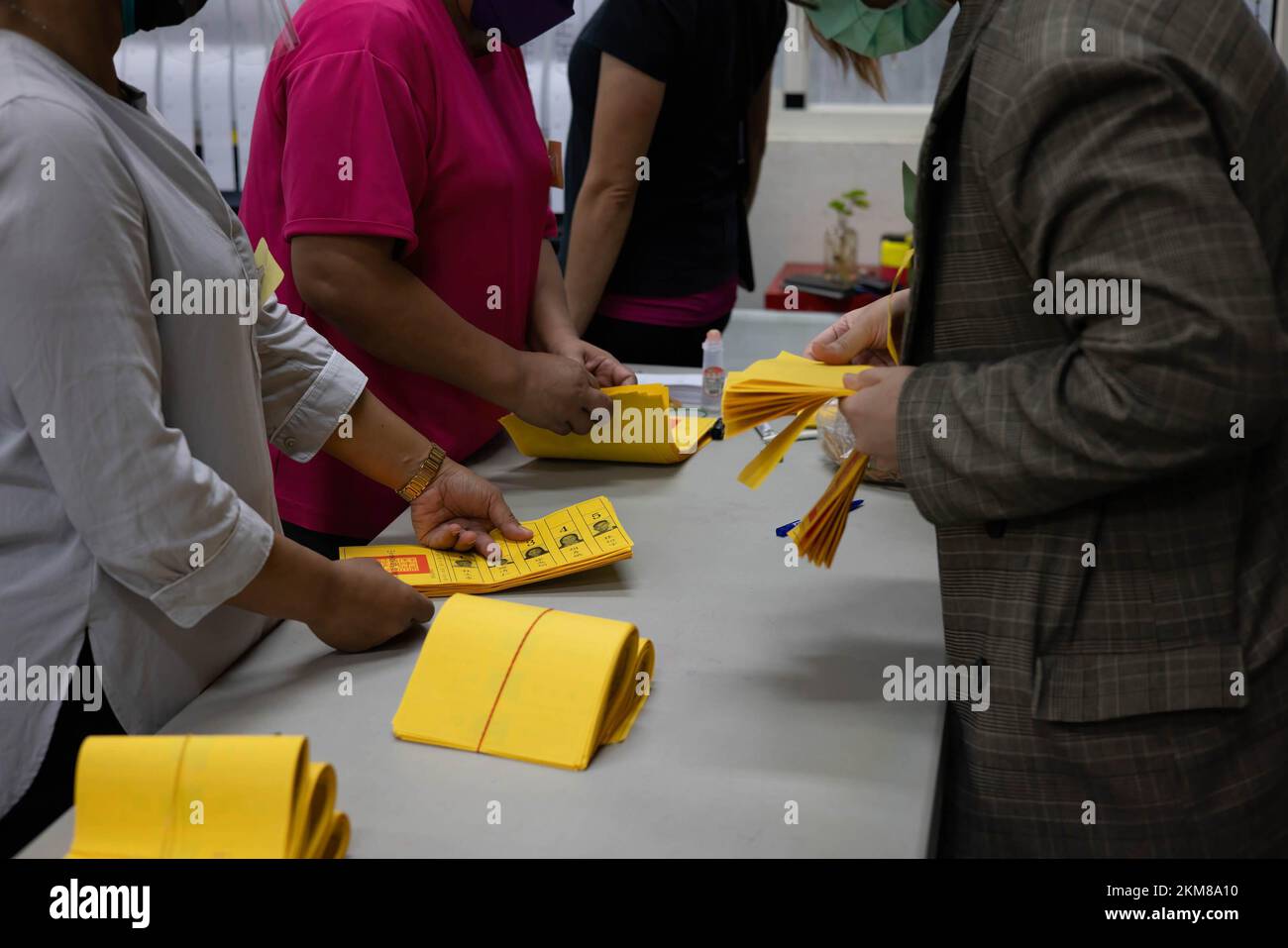 Taiwan. 26th Nov, 2022. A close-up of polling official counting votes ...