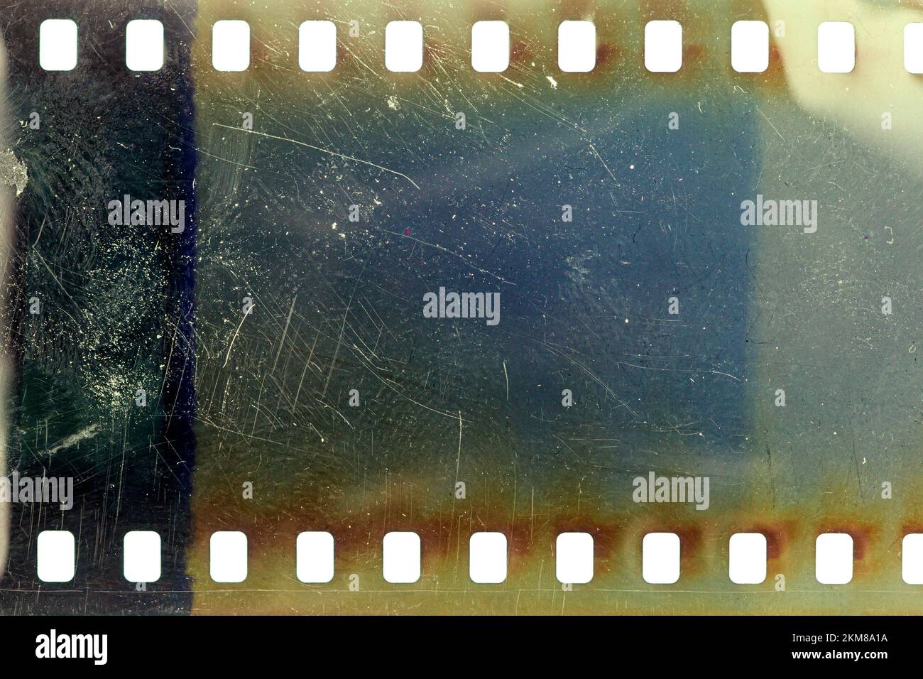 Dusty and grungy 35mm film texture or surface. Perforated scratched ...