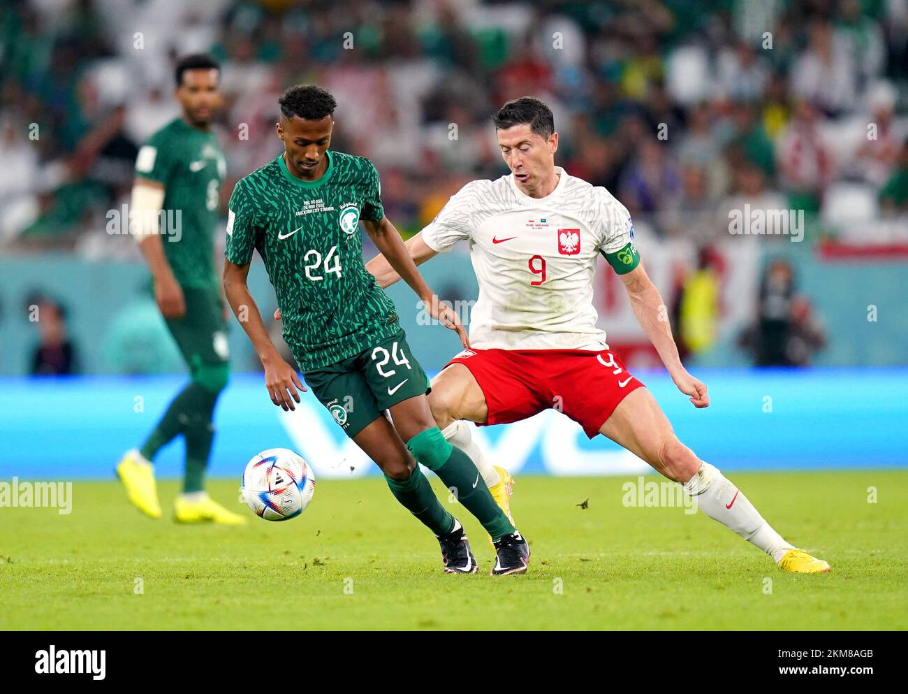 Saudi Arabia's Nasser Al-Dawsari (left) and Poland's Robert Lewandowski ...