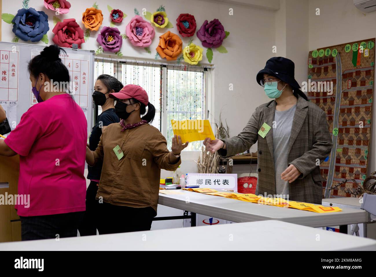 Polling official seen handling the counted votes at Rinari polling ...