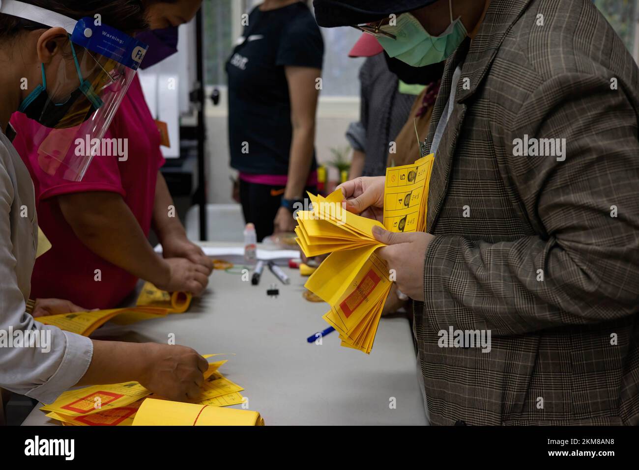 Taiwan. 26th Nov, 2022. A close-up of polling official counting votes ...