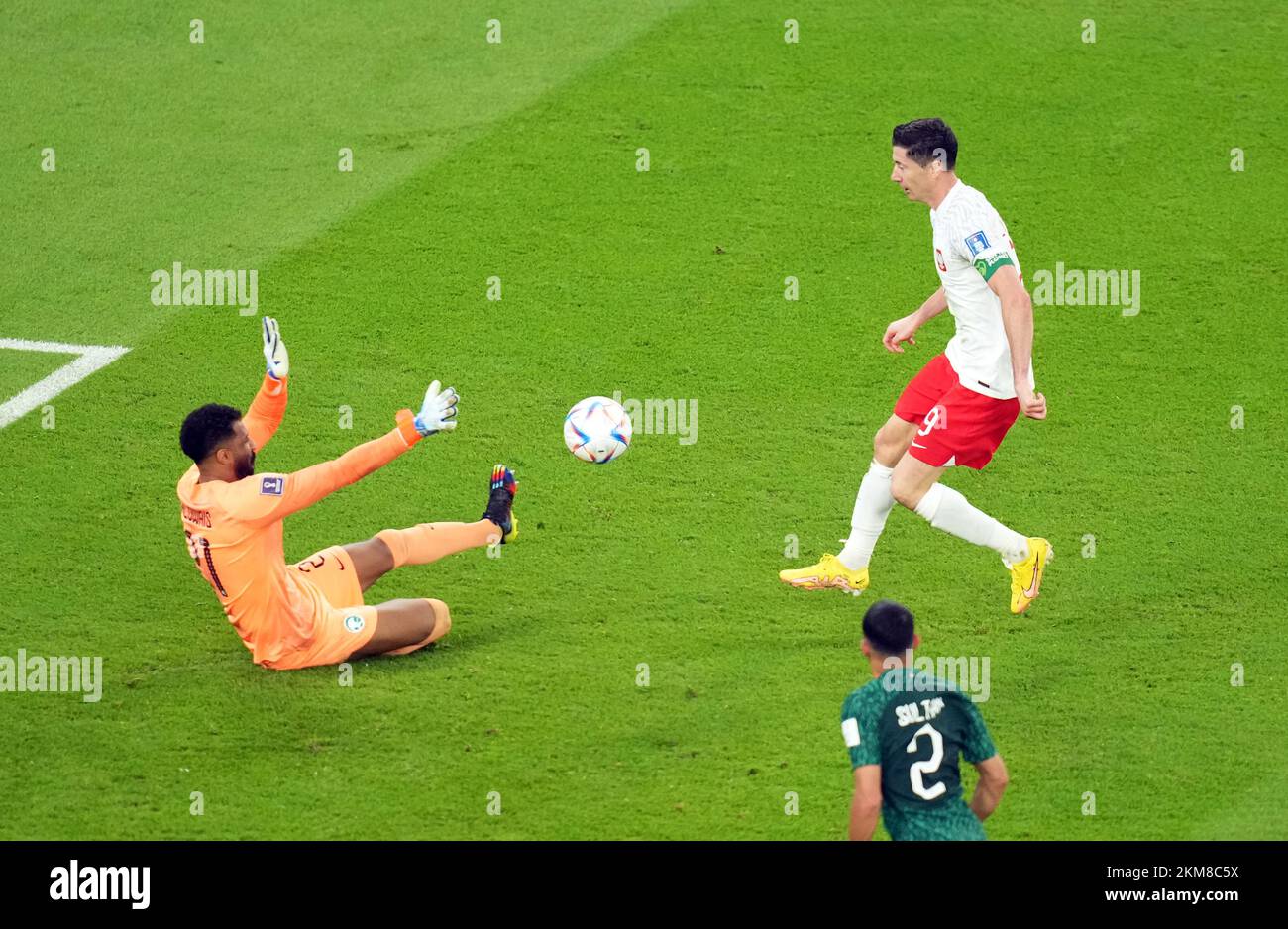 Saudi Arabia goalkeeper Mohammed Al-Owais saves from Poland’s Robert ...