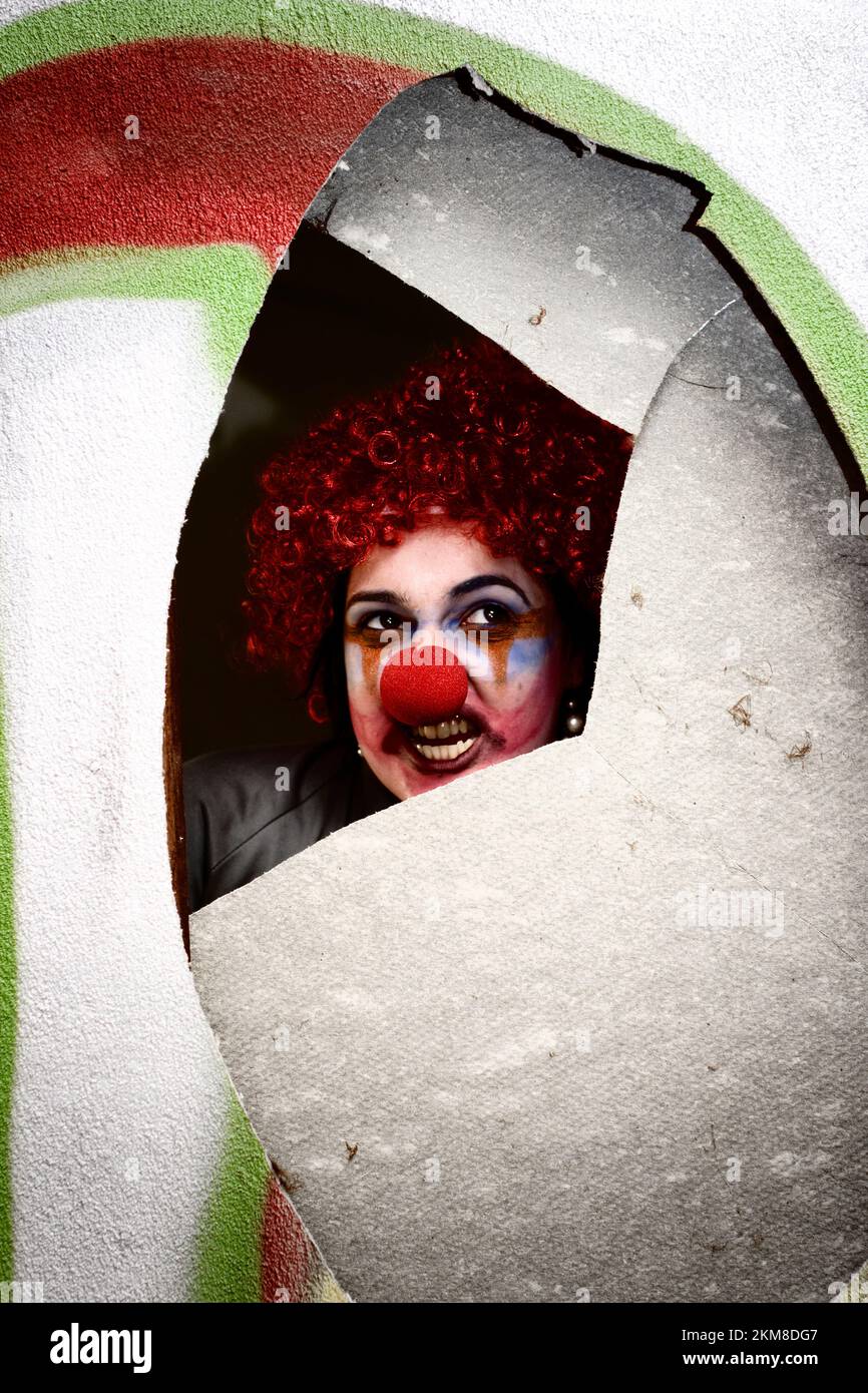 The Creepy Clown From Childhood Terrors Looks Through A Hole In The ...