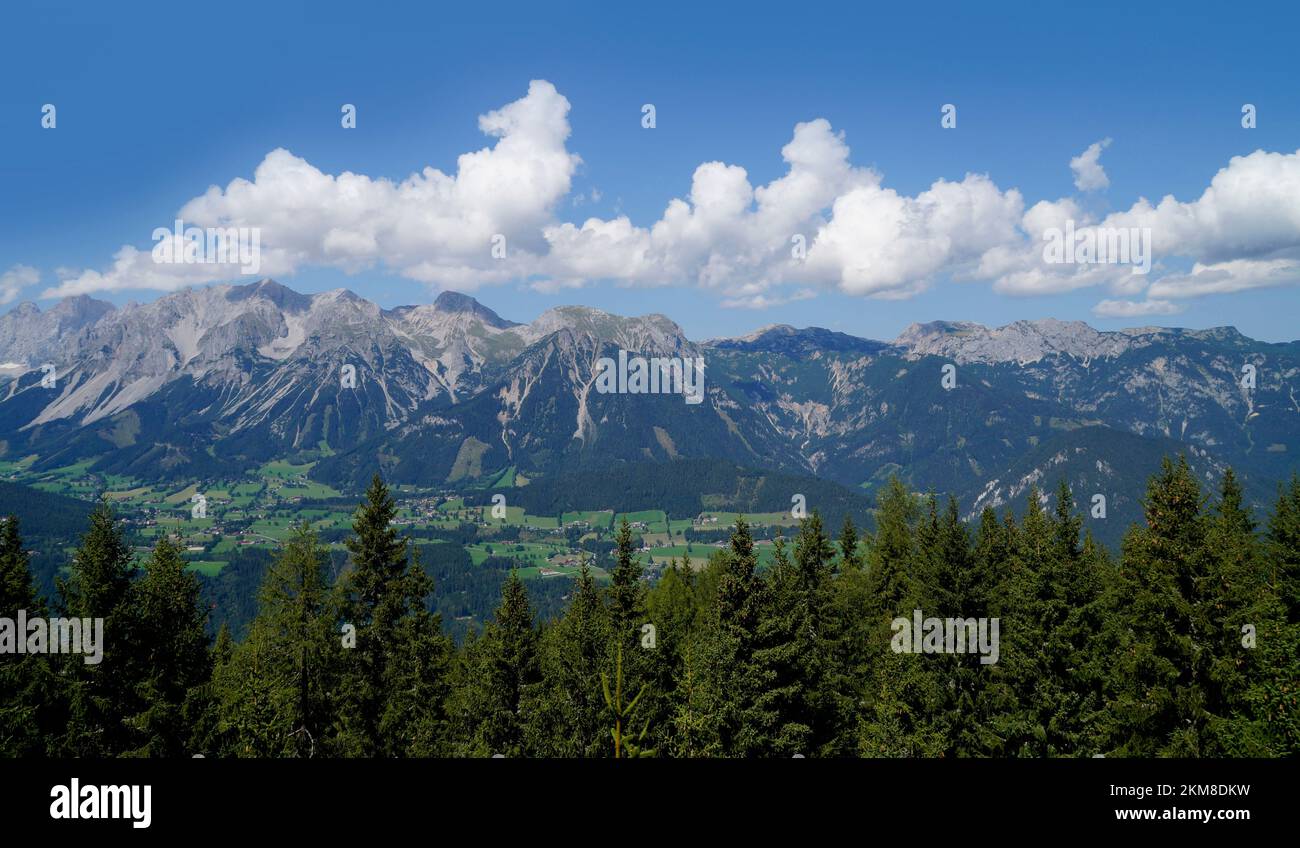 a hiking trail overlooking the beautiful alpine landscape with vast ...