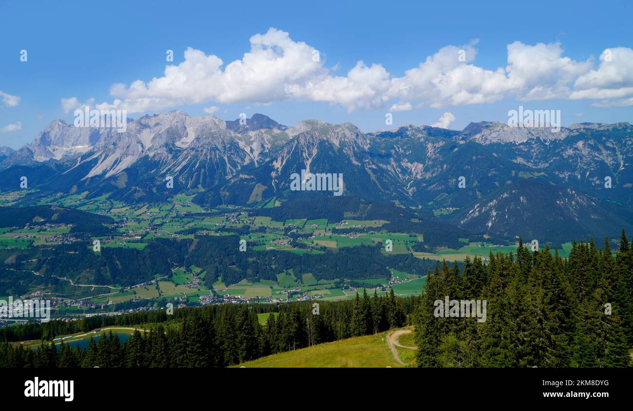 a hiking trail overlooking the beautiful alpine landscape with vast ...