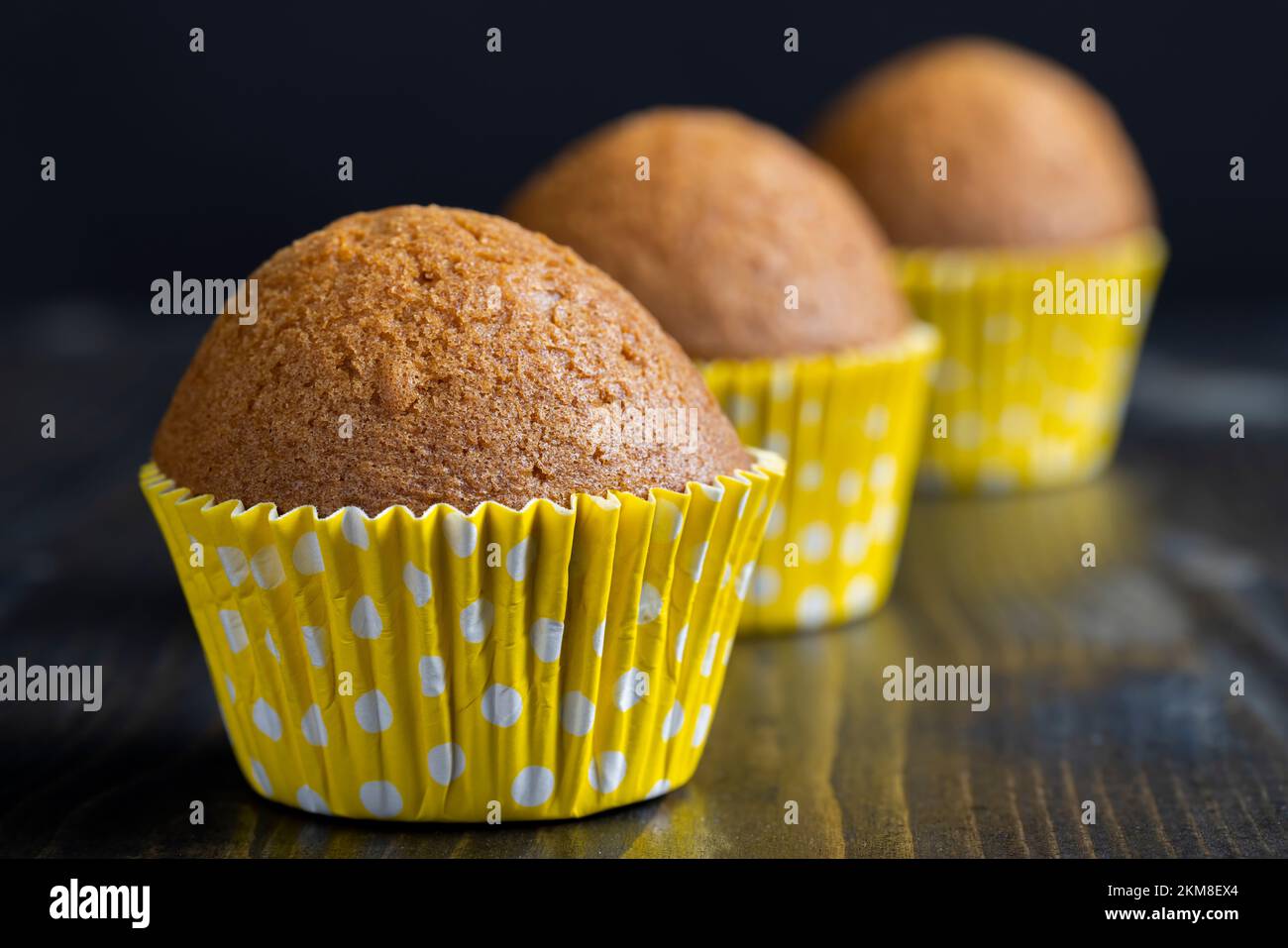 delicious wheat cupcakes on a black wooden table , fresh homemade ...