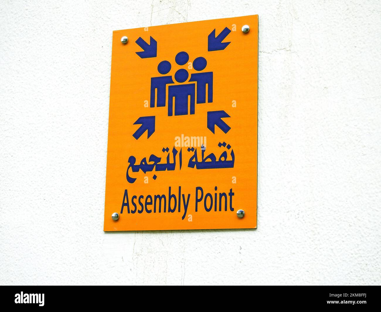 Assembly Point Sign in Arabic and English languages that uses safety ...