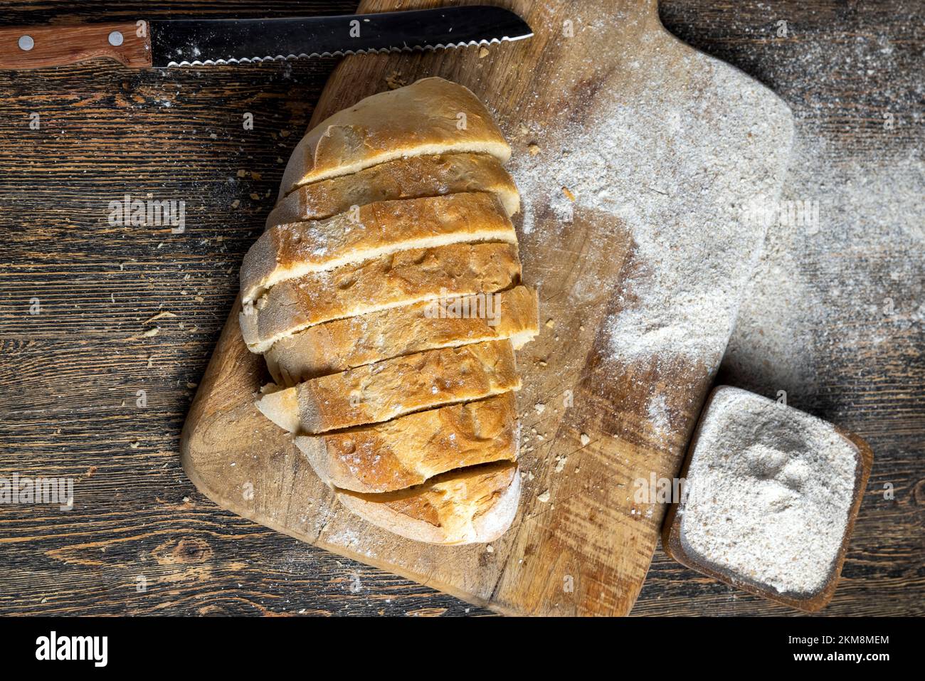 cut fresh bread into pieces while cooking with bread, the bread is cut ...