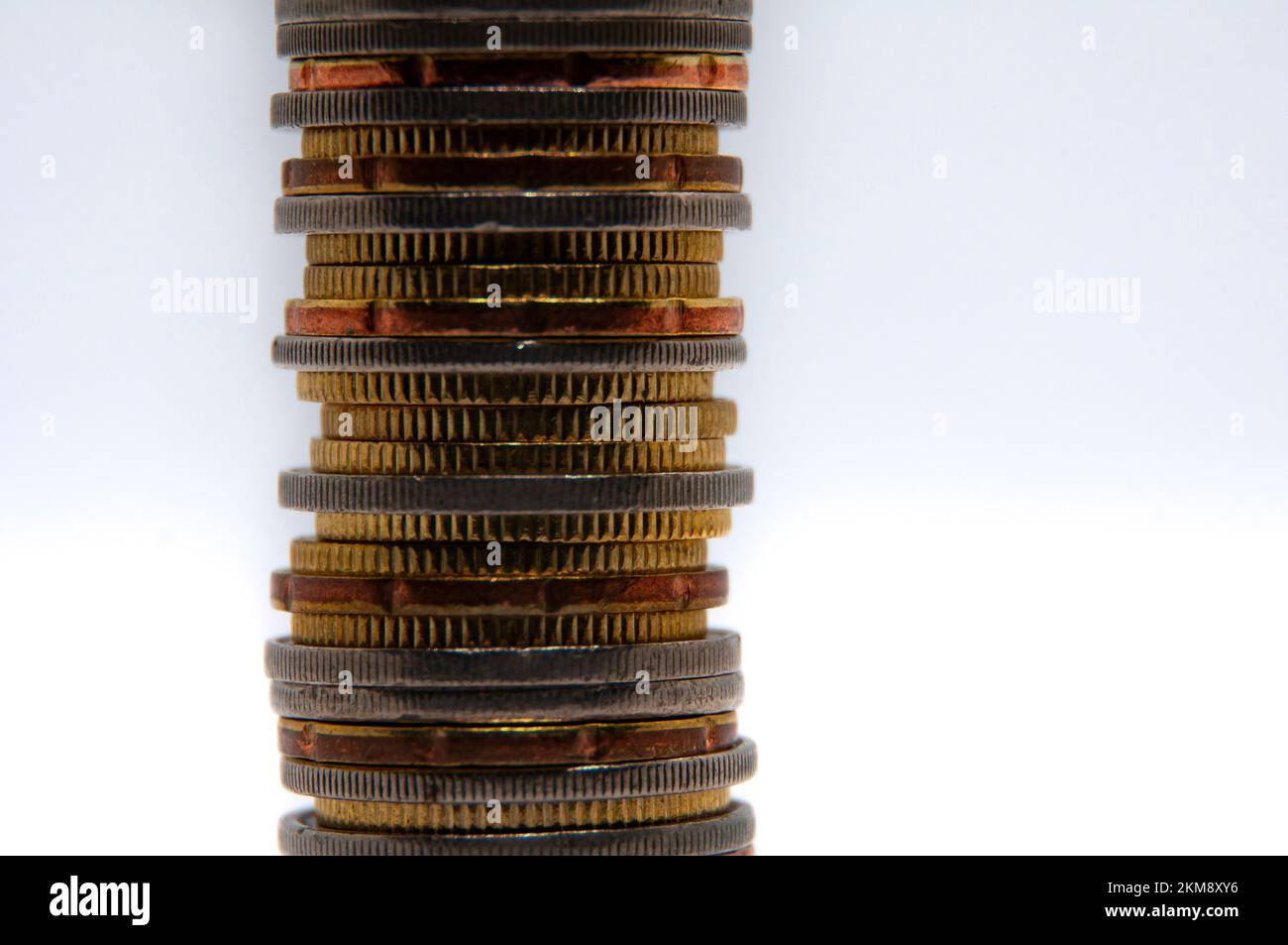 Close up of coins on white background with customizable space for text ...