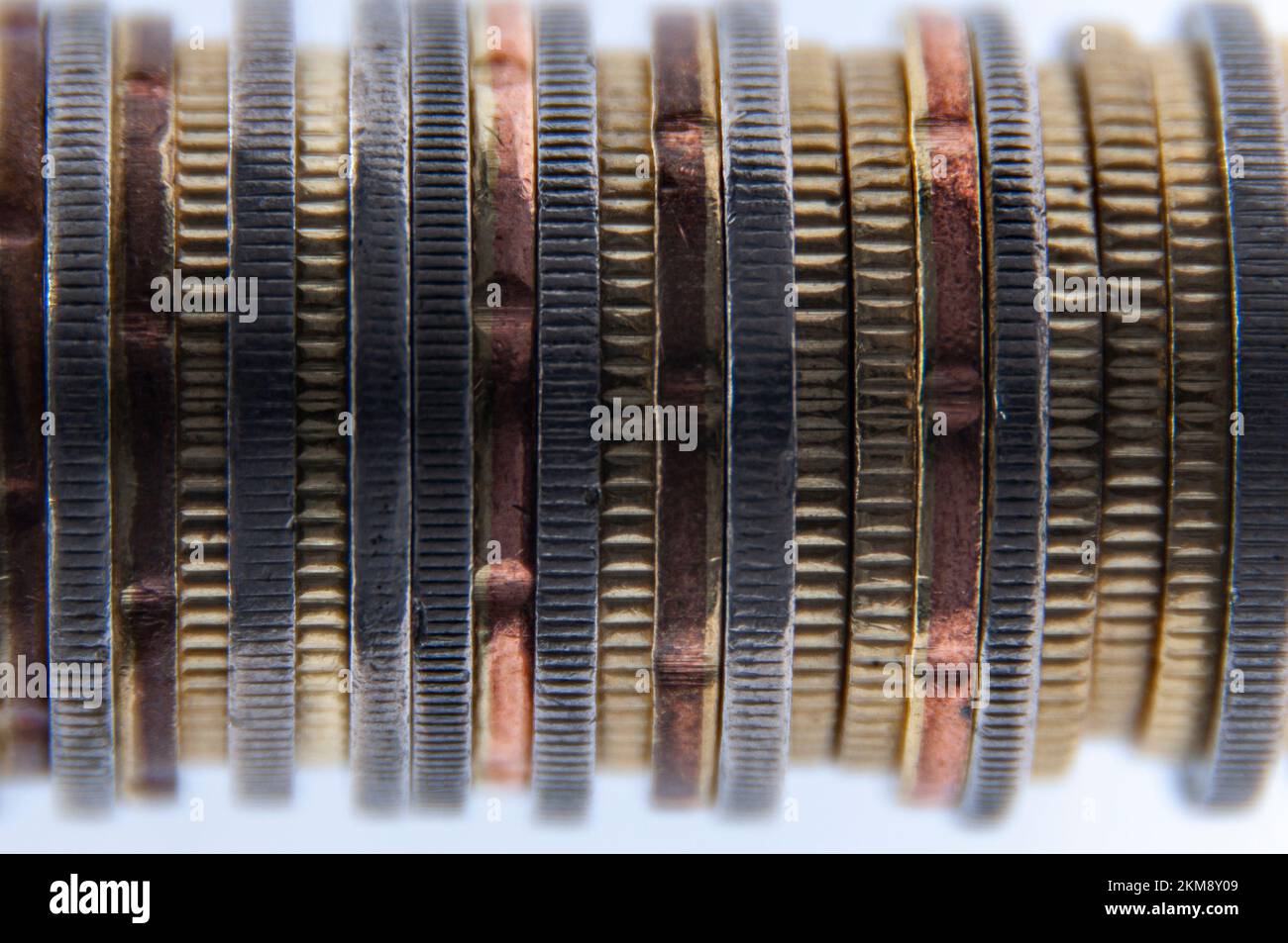 Close up of coins on white background with customizable space for text ...