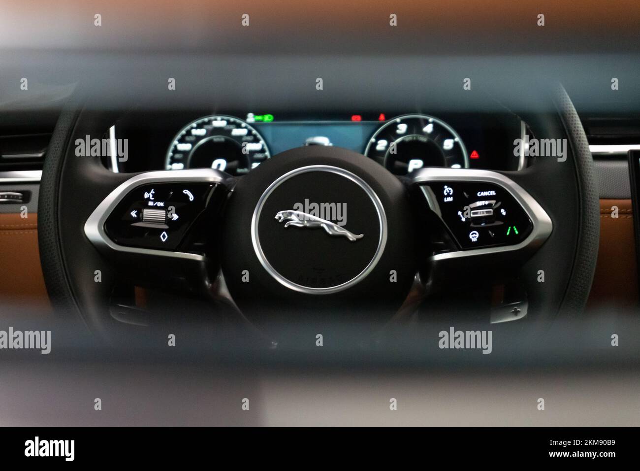 A closeup of the Jaguar F-Pace steering wheel behind driver's seat ...