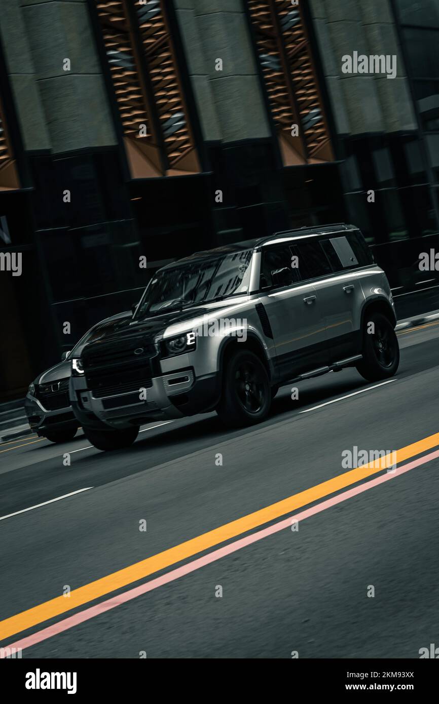 Silver vehicle in downtown Singapore Stock Photo - Alamy