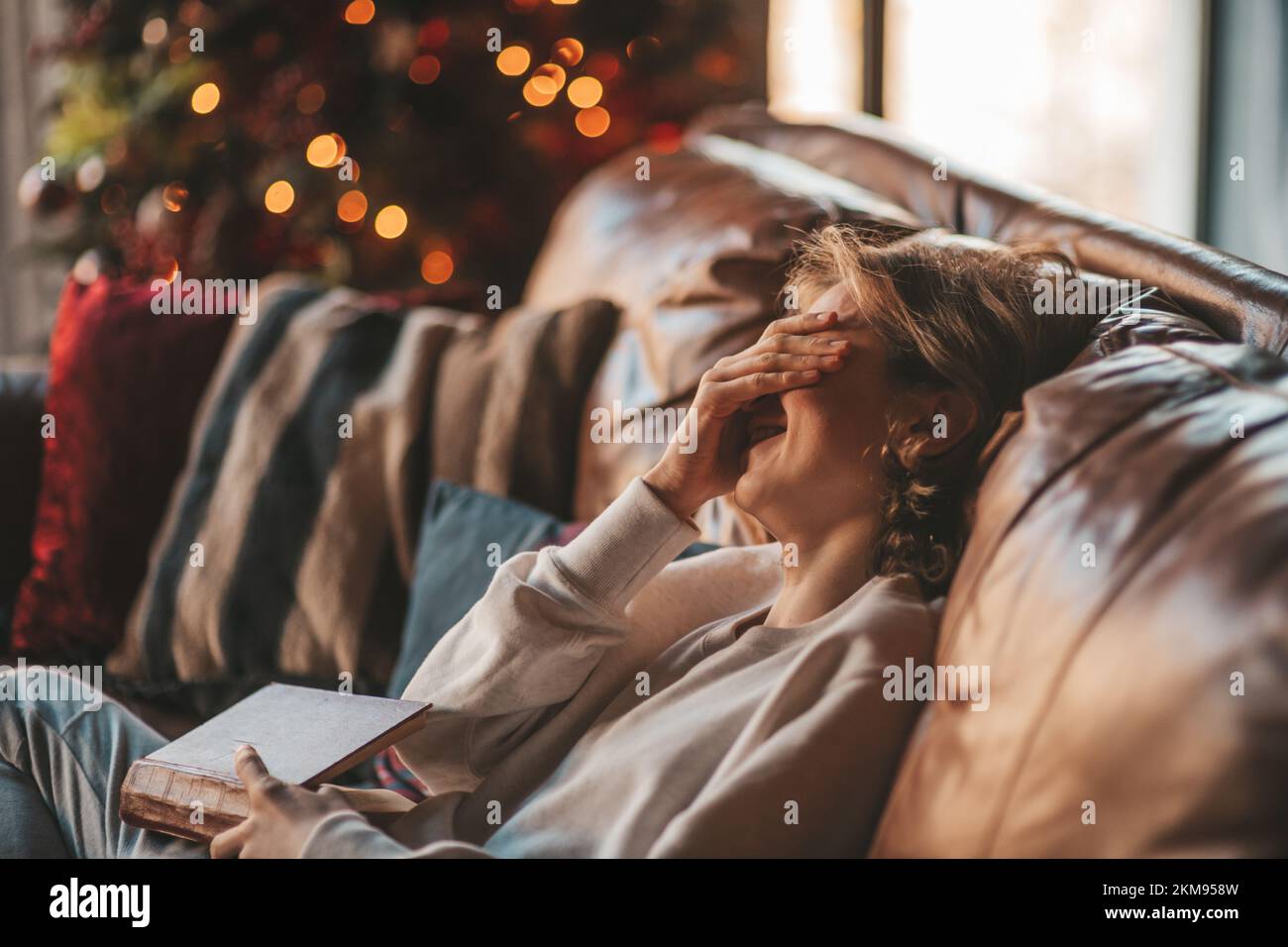 Young emotional cheerful teen boy with long hair laughter and joyful at ...