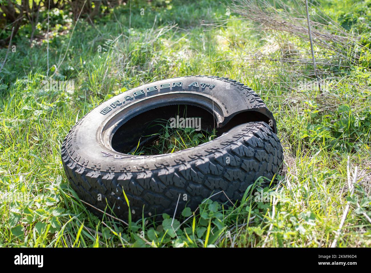Abandoned Old Tyre UK Fly Tipping RubbishTire Stock Photo - Alamy