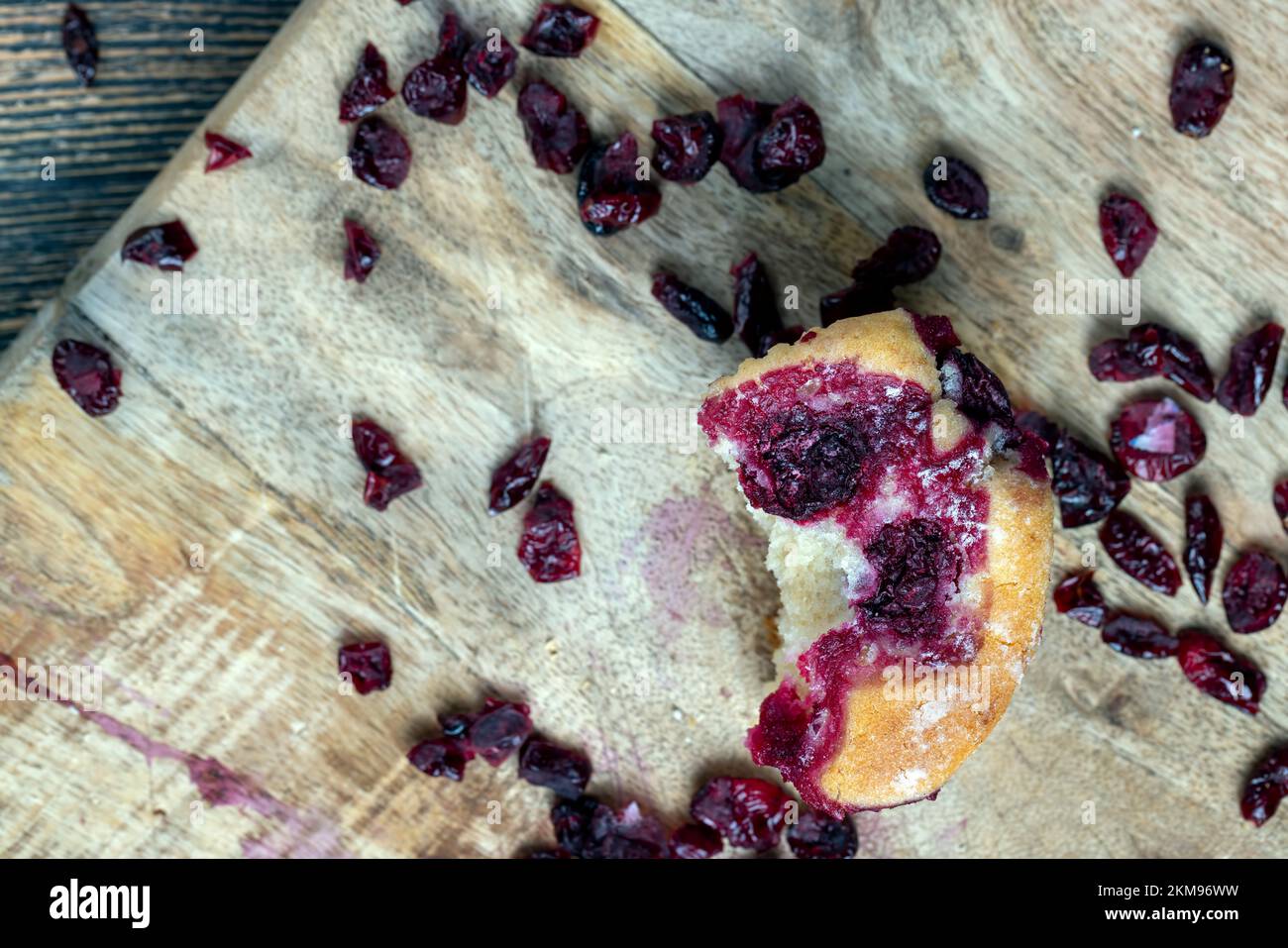 wheat pastries with red cherry strawberry filling on a board, dried ...