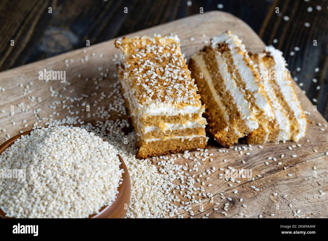 creamy cream and caramel cakes sprinkled with sesame seeds during ...