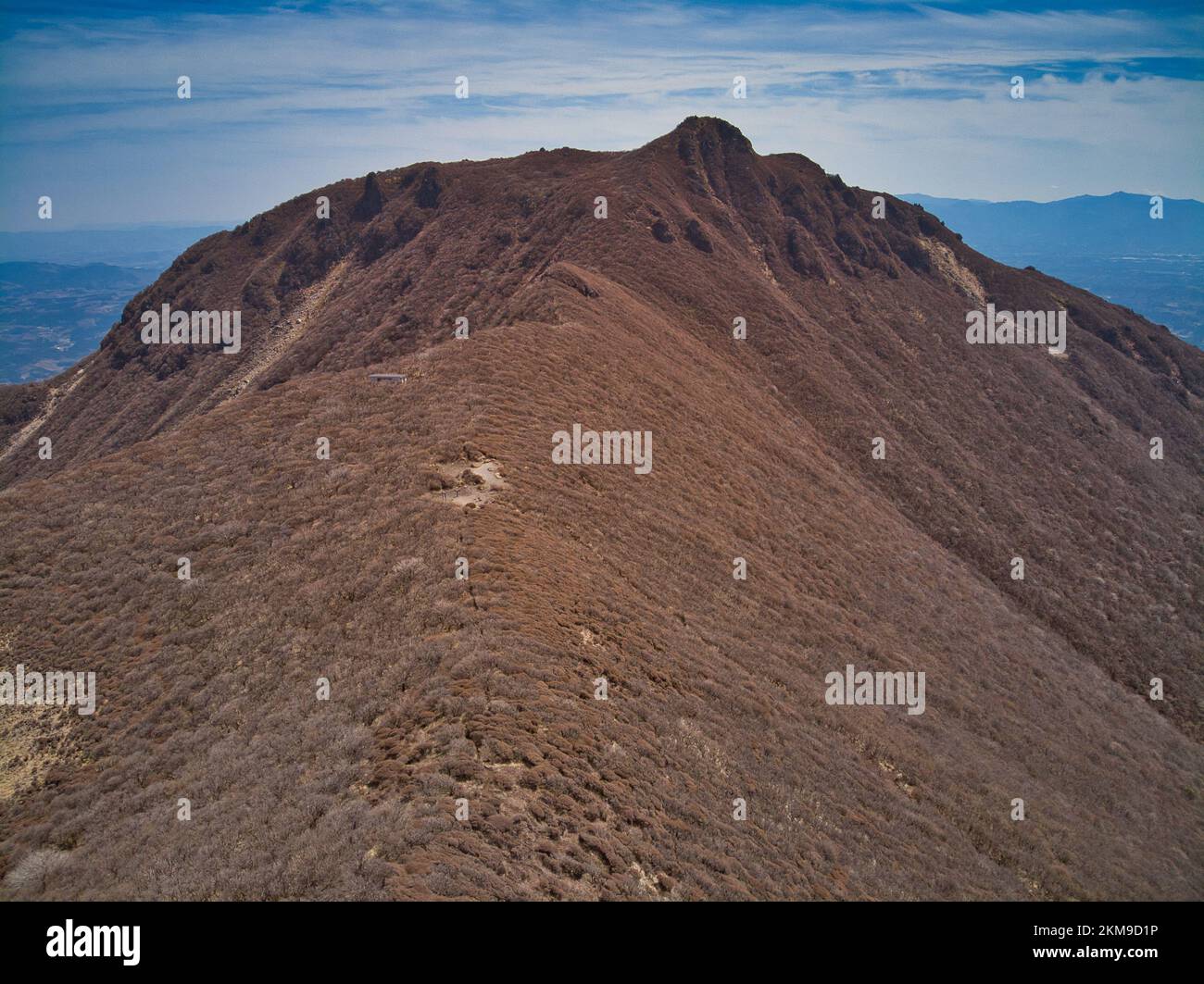 The aerial view of Kuju mountain against the background of blue sky ...
