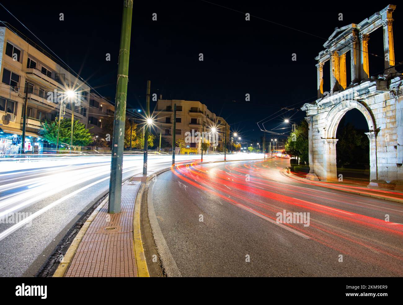 Night shot of traffic around Hadrian's Arch, Athens, Greece Stock Photo ...