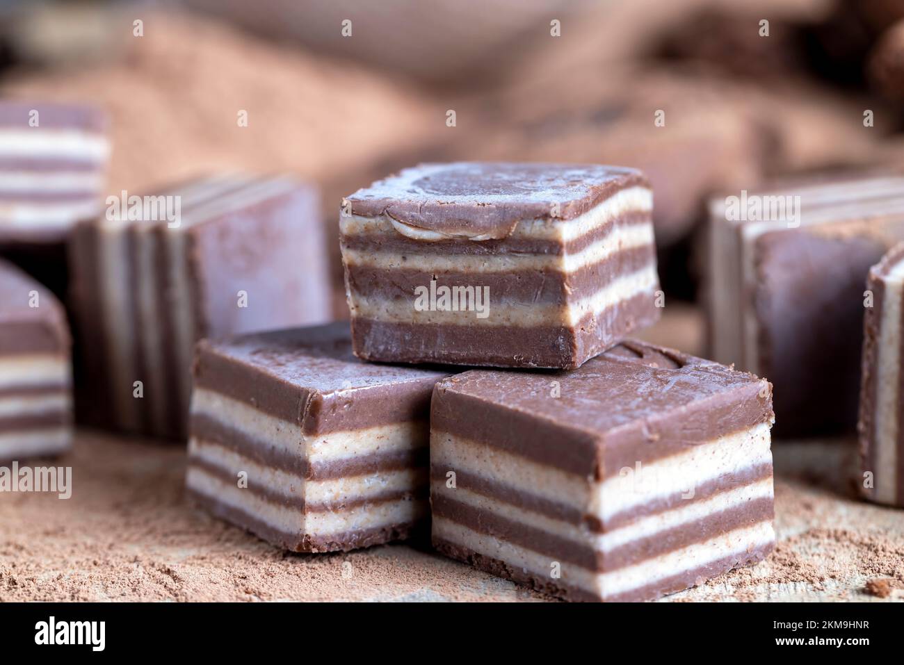 multi-layered sweets made of cream and chocolate layers with different ...