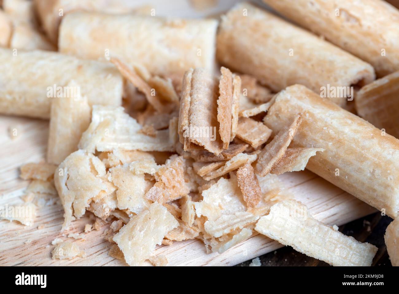 thin crispy waffles lie on a black table, sweet food for desserts Stock ...