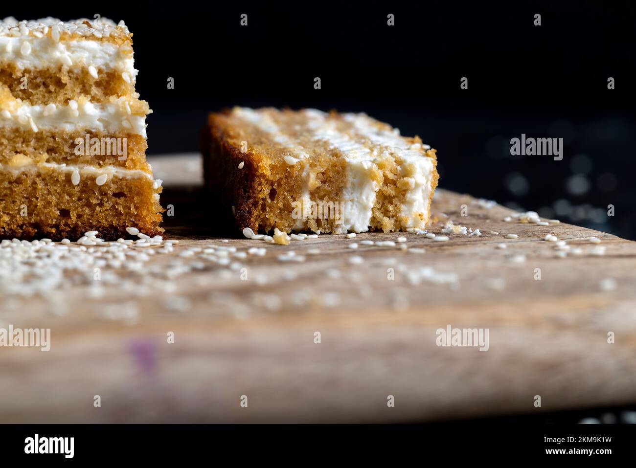 creamy cream and caramel cakes sprinkled with sesame seeds during ...