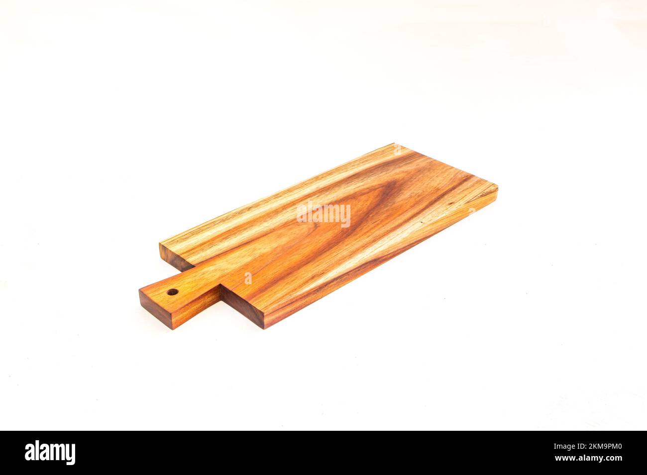 A closeup of a natural wooden cutting board isolated on the white ...