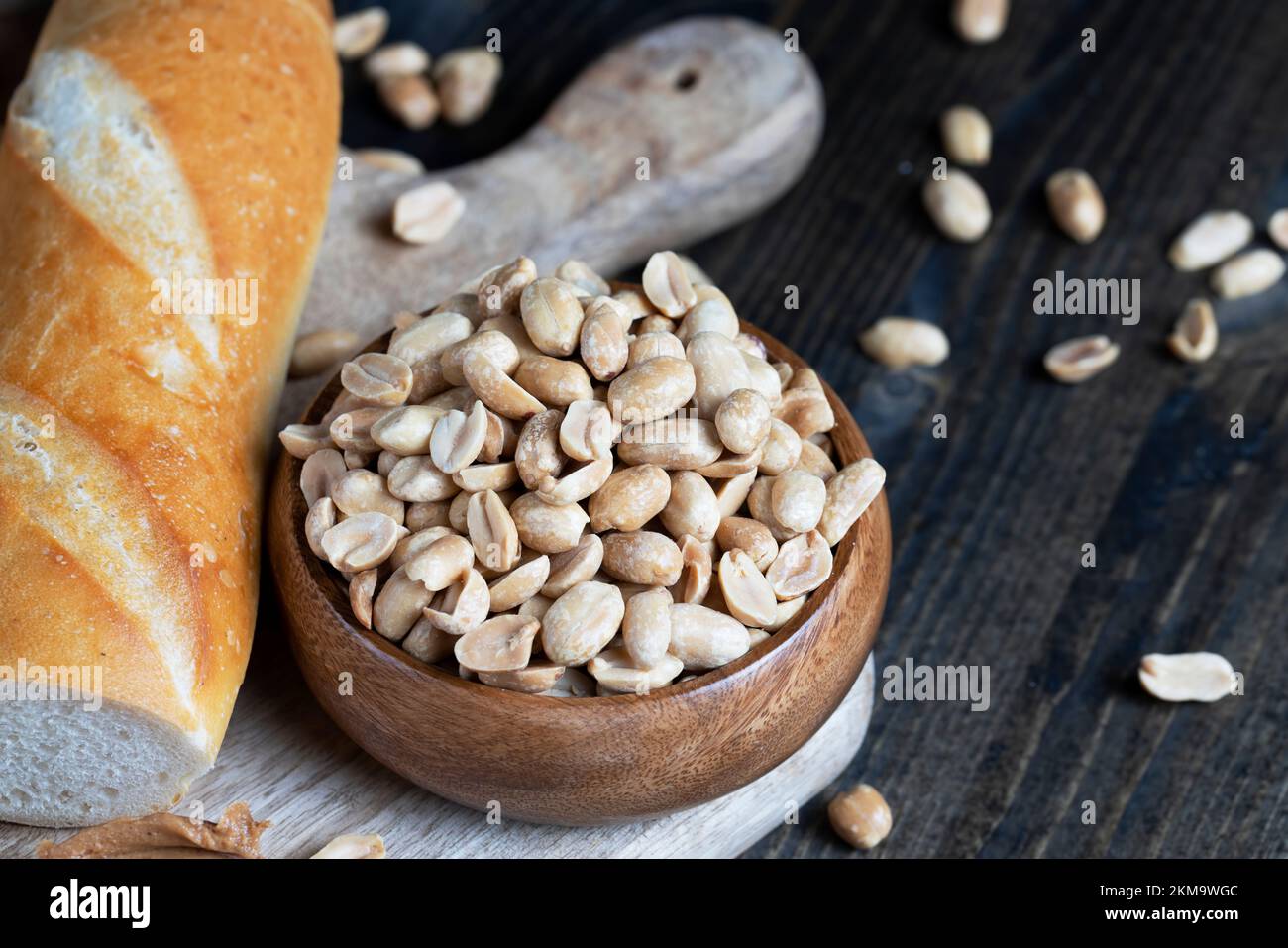 roasted peanuts peeled from the shell on a wooden table, peanuts fried ...