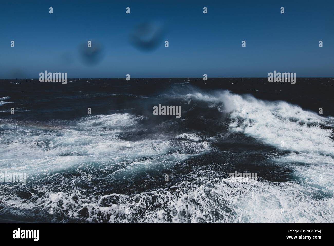 Boat wake waves in the Drake Passage, causing spray to come off the ...