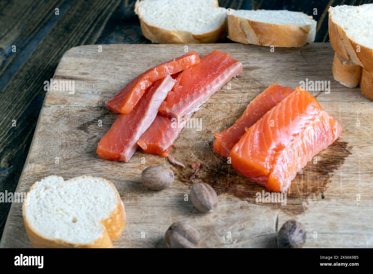 red salted salmon fish meat on a chopping board, salted salmon fish ...