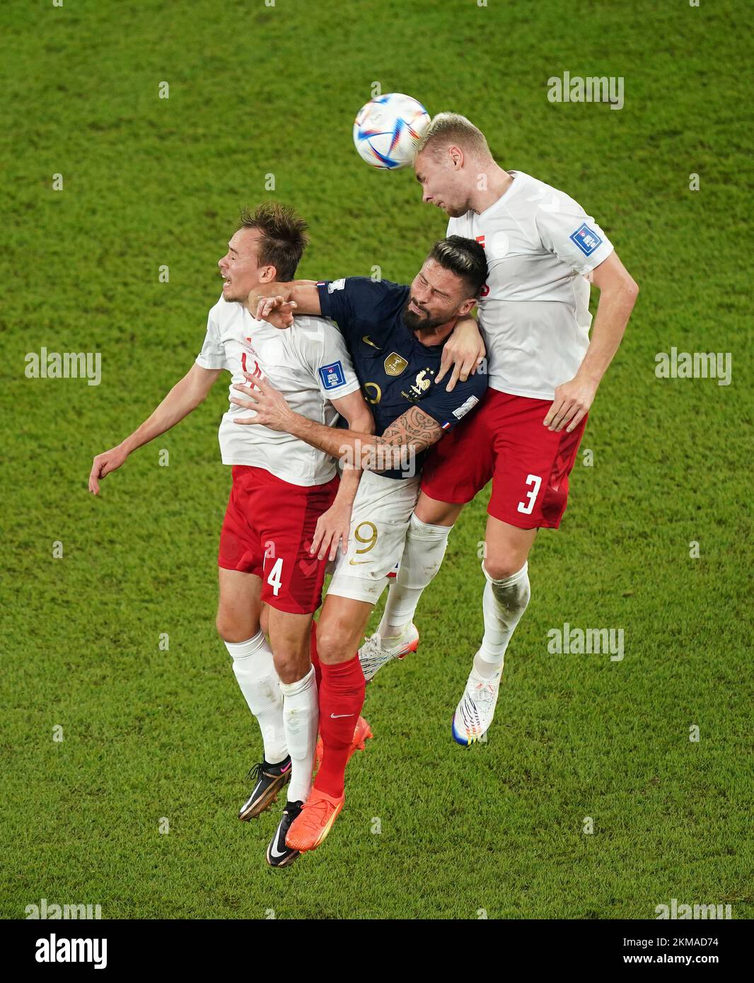 France's Olivier Giroud (centre) battles with Denmark's Mikkel ...