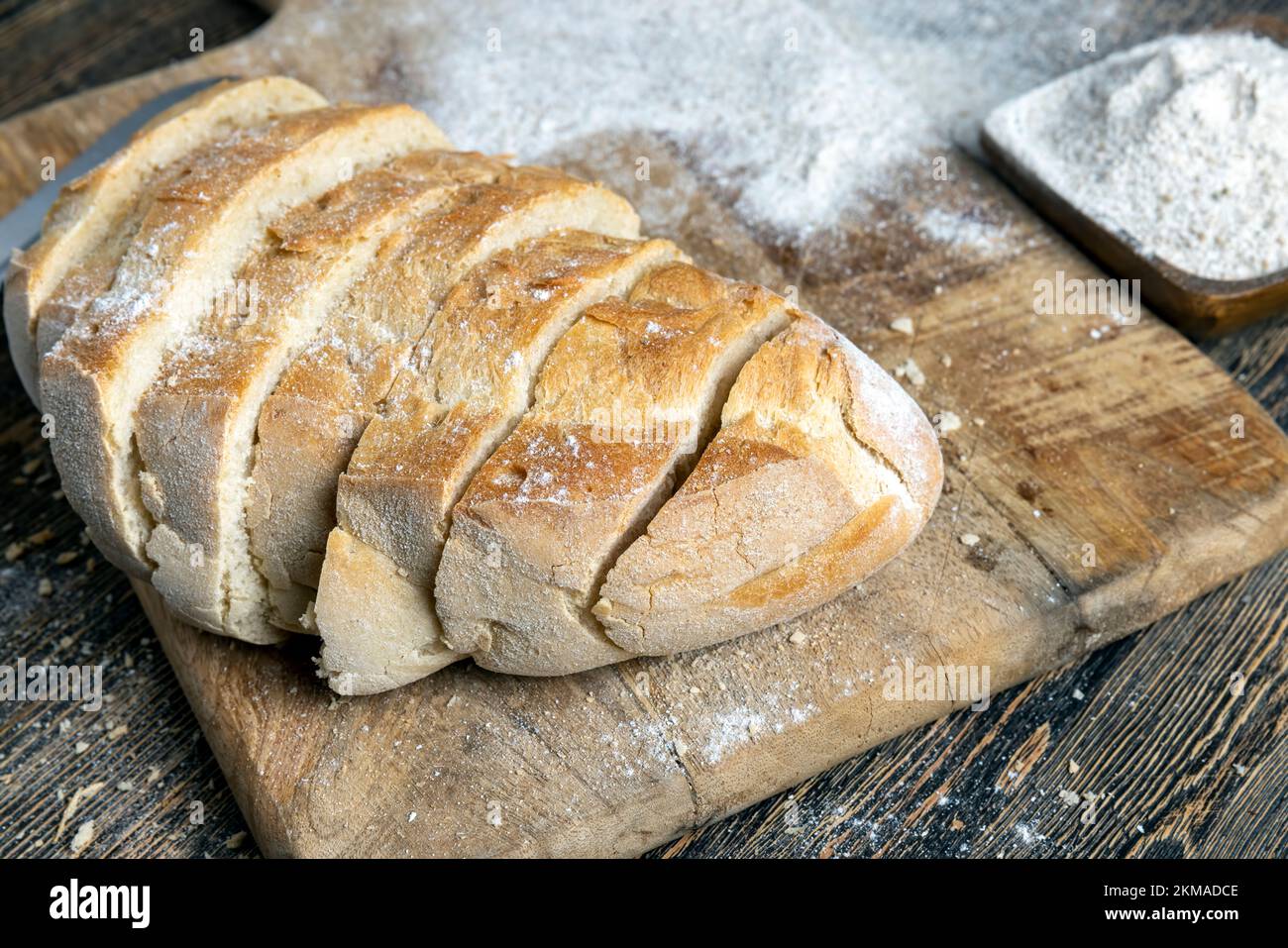 cut fresh bread into pieces while cooking with bread, the bread is cut ...