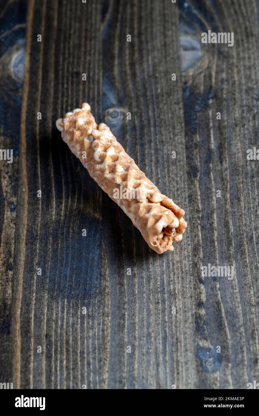 thin crispy waffles lie on a black table, sweet food for desserts Stock ...