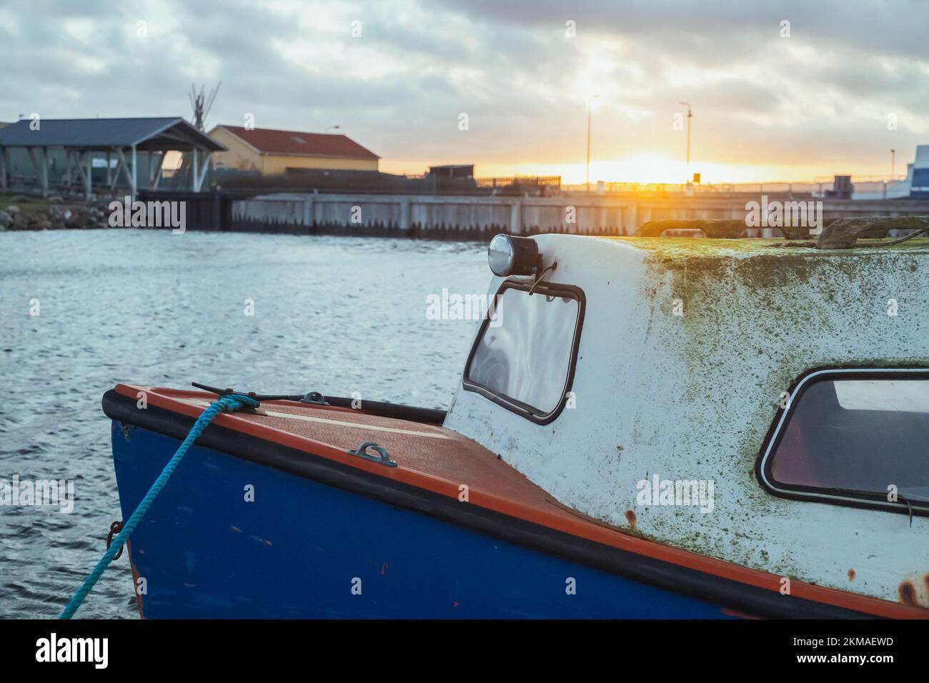Old moss-covered boat at sunset in Denmark Stock Photo - Alamy