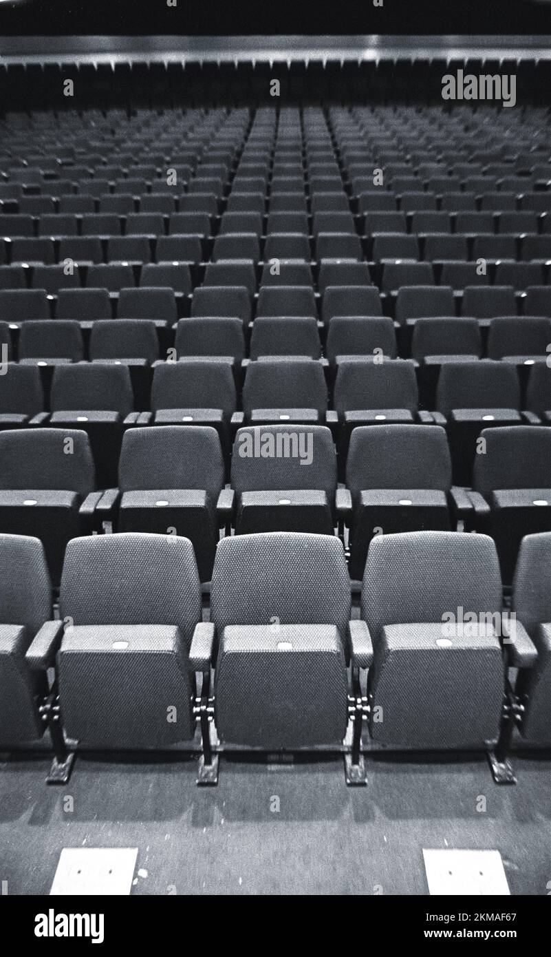 Symmetrical image of rows of empty concert hall seats hi-res stock ...