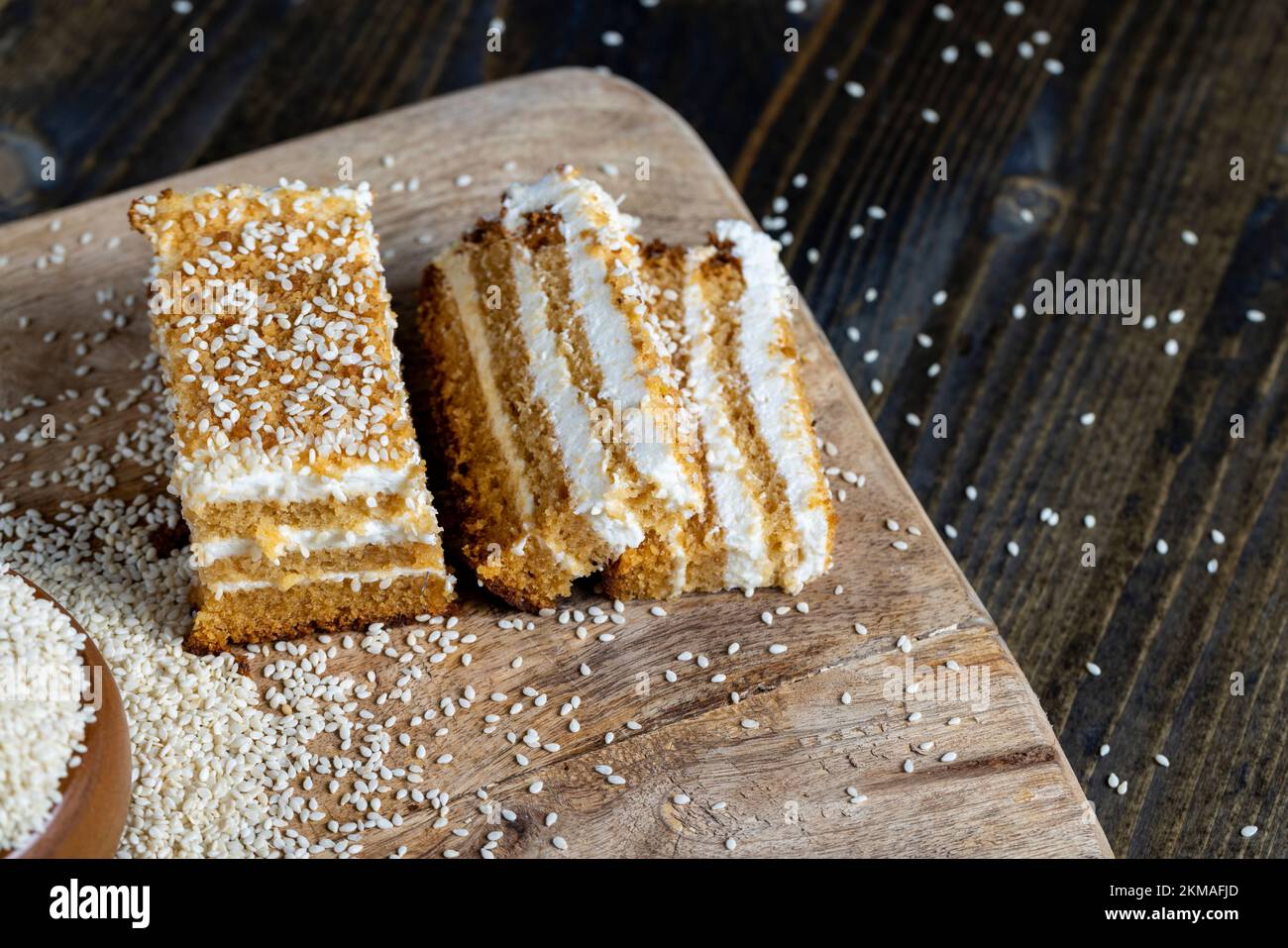 creamy cream and caramel cakes sprinkled with sesame seeds during ...