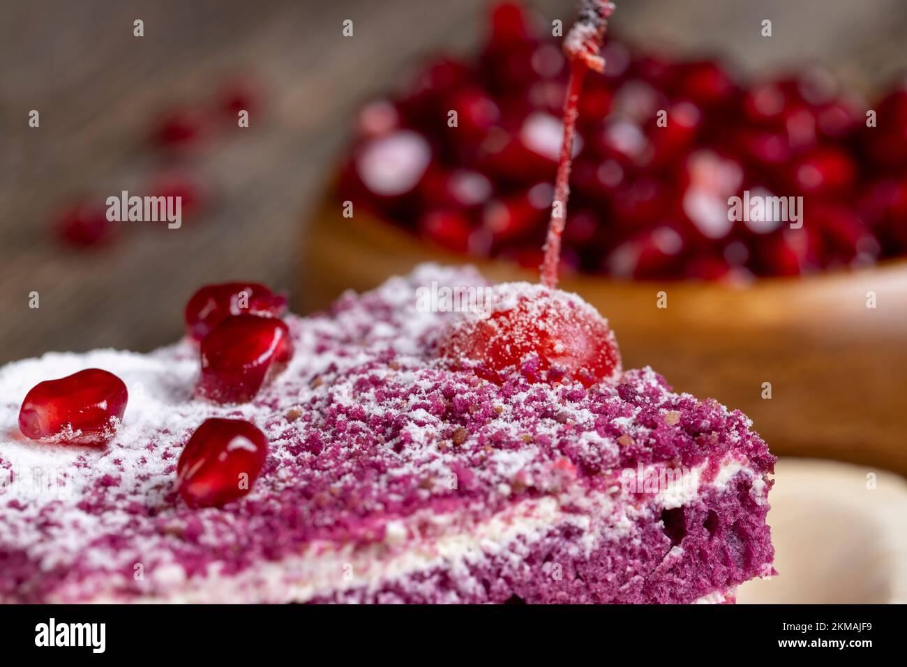 a maroon-colored cake with the taste of different berries and a creamy ...