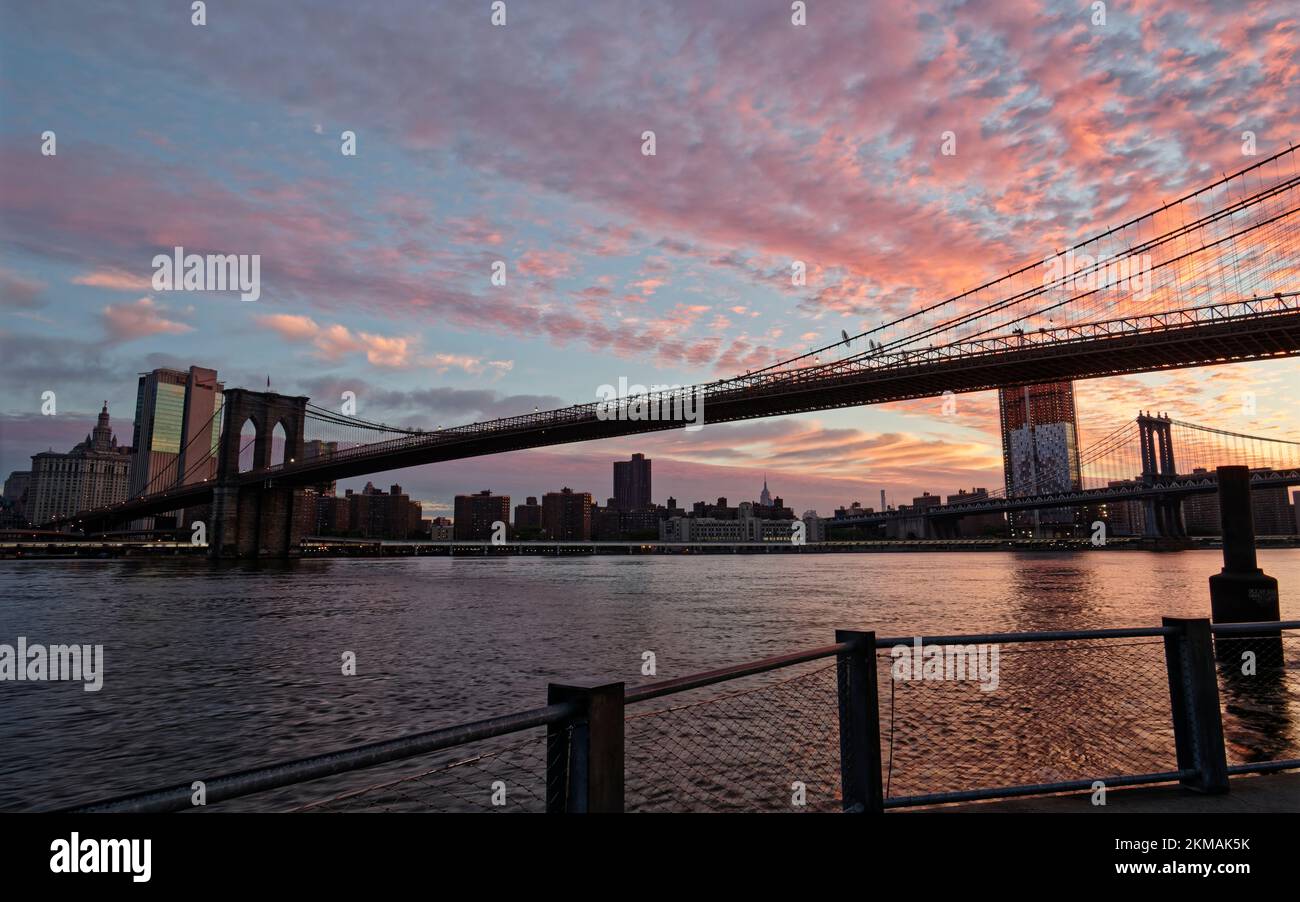The view of Brooklyn Bridge and East River at sunset. New York City ...